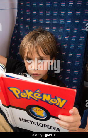Children reading Pokemon book Stock Photo - Alamy