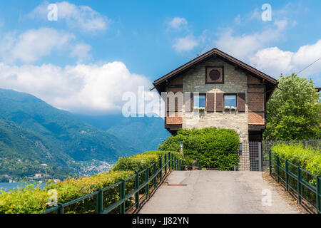 Alps style house next to Lake Como, Italy on a beautiful summer day ...