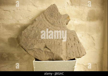 The ancient Quern stone hand mill with grain. The man grinds the Stock ...