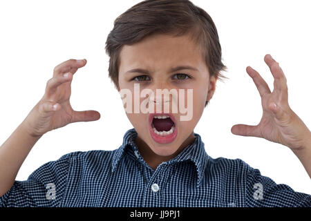 Cute boy shouting against white background Stock Photo - Alamy
