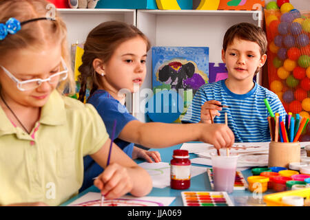 Small students girl and boy painting in art school class Stock Photo ...