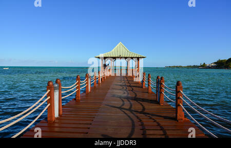 Mahebourg, Mauritius - Jan 3, 2017. Wooden bridge of pier in Mahebourg ...
