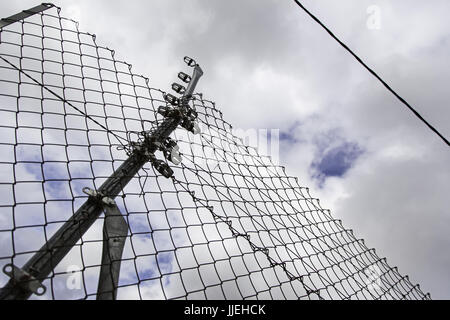 prison guard opening prison gate Stock Photo - Alamy
