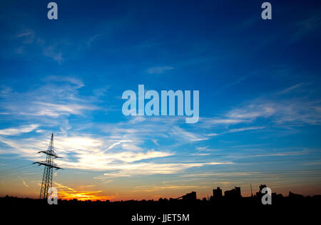 Sehnde, Germany, sunset behind high voltage line Stock Photo - Alamy