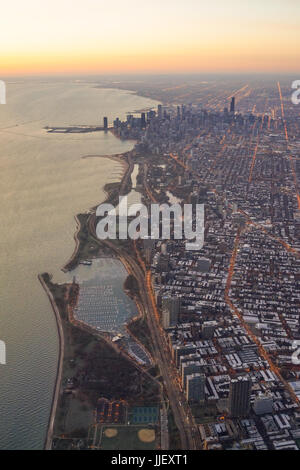 An aerial Chicago skyline at sunrise with a view of the navy pier and ...