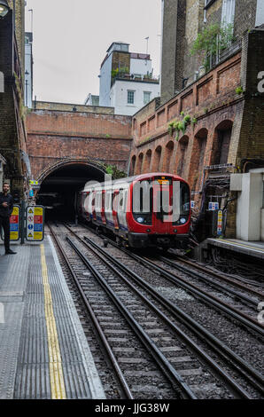 Circle Line train arriving at Notting Hill Gate tube station, Notting ...