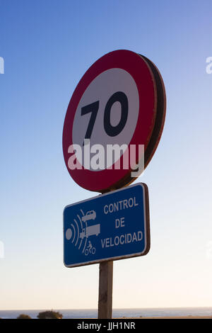 Isolated traffic sign. Seventy miles per hour speed limit sign round ...