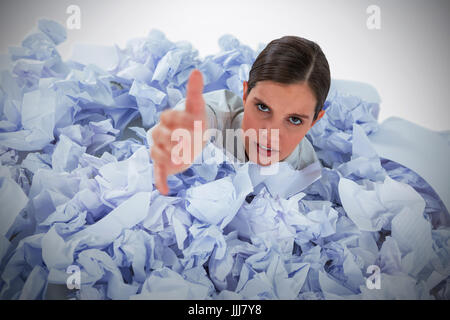 Conceptual image of woman in heap of crumple paper asking for help ...
