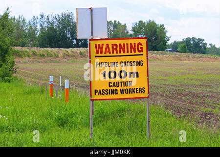 Warning Pipeline Crossing Caution sign Stock Photo - Alamy