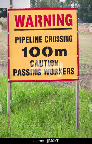 Warning Pipeline Crossing Caution sign Stock Photo - Alamy