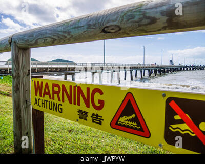 Warning sign for saltwater crocodiles on the beach in Far North ...