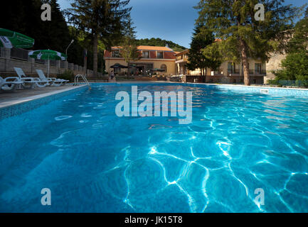 Outdoor swimming pool mountain hotel pool resort chair pool lounge ...