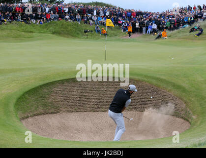 USA's Dustin Johnson chips out of a bunker on the 13th during the third ...