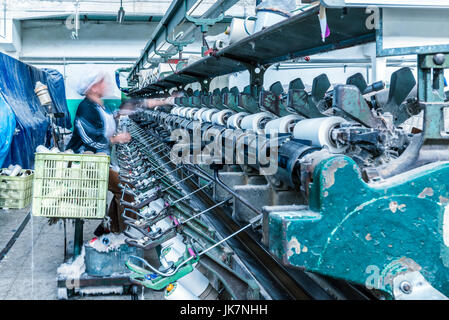 Textile mill workshop interior, working female workers Stock Photo - Alamy