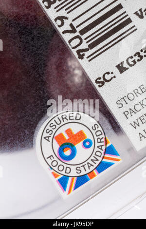 Closeup on Red Tractor logo. Assured Food Standards is a UK company ...