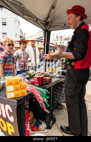 Open market stall with magic tricks on. Zenea, local magician ...