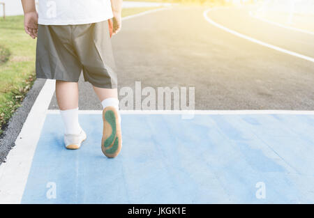 Obese fat boy exercise at park on morning, concept exercise and healthy ...