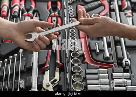 Open toolbox and male hands Stock Photo - Alamy