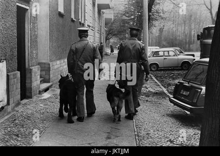 East German Border Guards patrol the Berlin Wall in East Germany in ...