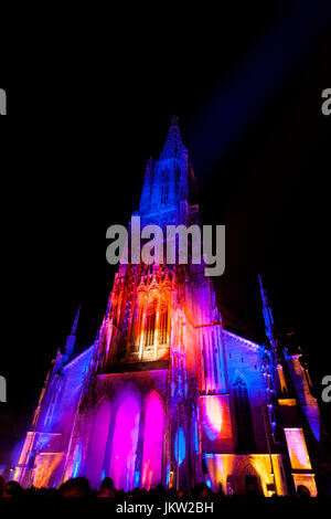 The world's tallest spire of the Ulm Minster towers above the city in ...