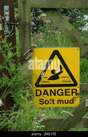 Danger Soft Mud warning sign on the beach Stock Photo - Alamy