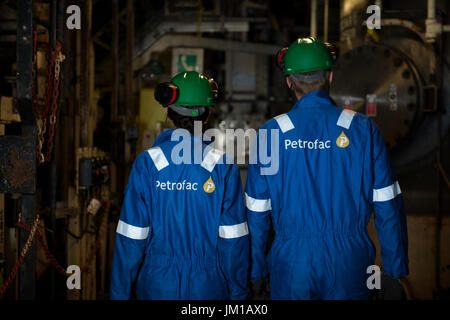 Workers on the BP Miller oil and gas rig, in the north sea, as Petrofac ...