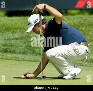 Brian Harman sets up to putt on the 14th green during the second round ...