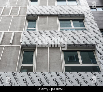 External cladding being fitted to new apartment block in Spain Stock ...