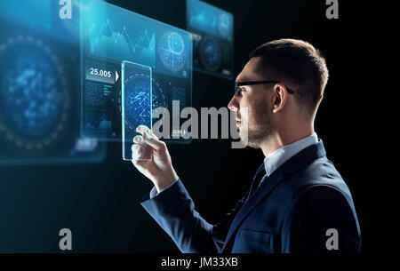 businessman with tablet pc and virtual screens Stock Photo - Alamy