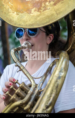A band musician plays the tuba during the annual national parade of ...
