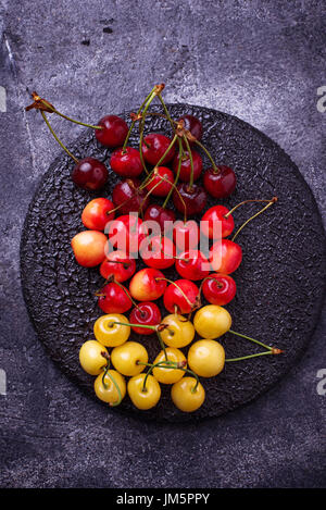 Different type of colorful cherries. Selective focus Stock Photo - Alamy