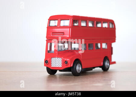 Red London bus wooden toy on white background - for London Transport ...