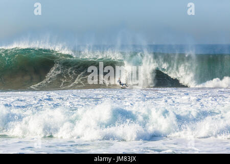 Surfer falling off a large wave at Langland Bay near Swansea Stock ...