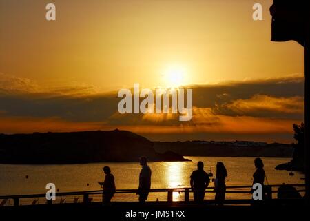 People watching sunset menorca minorca Stock Photo - Alamy