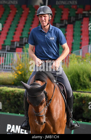 Ludger Beerbaum from Germany and his horse Gotha clear an obstacle ...