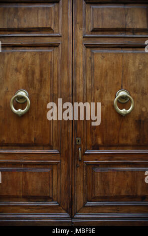 Closeup of old door handles and a keyhole with antique decorations ...