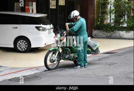 postman on a motorcycle Stock Photo - Alamy