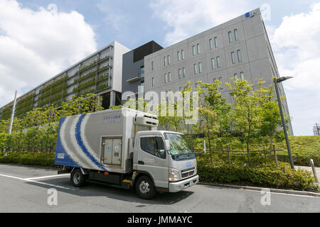 A Sagawa Express delivery truck drives past the Sagawa headquarters on ...