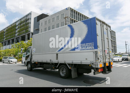 A Sagawa Express delivery truck drives past the Sagawa headquarters on ...