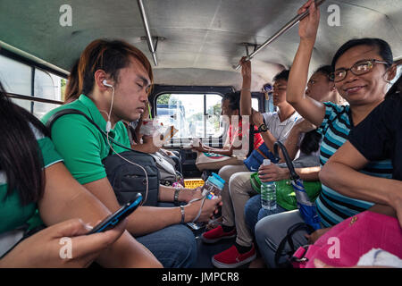 Jeepney and passengers, Angeles City, Pampanga, Philippines Stock Photo ...