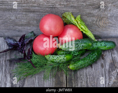 Red tomatoes on the old board Stock Photo - Alamy