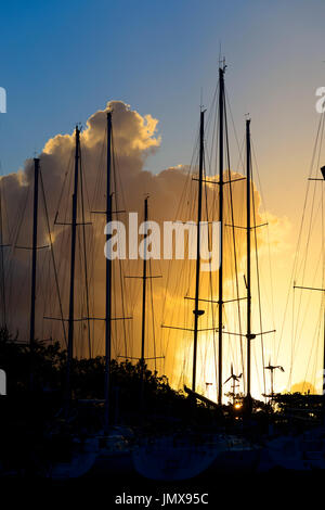 mast sailing into sunset Stock Photo - Alamy