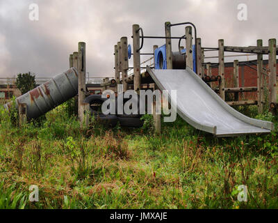 Old rusted playground, abandoned aged swings, destroyed childhood ...