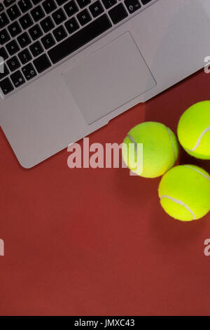 Overhead view of sports equipment with computer technology and money ...
