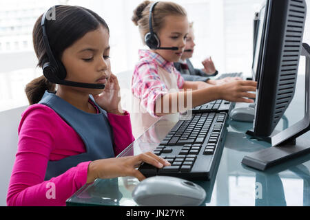 Kids as customer care executive working in the office Stock Photo - Alamy