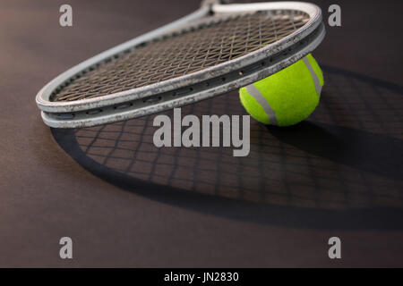 Shadow of a tennis racket over a tennis ball Stock Photo - Alamy