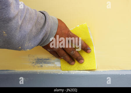 plastering man hand sanding the plaster in white wall Stock Photo ...
