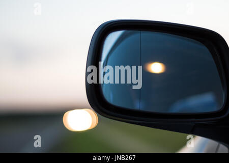 Sunset light reflecting on a highway, making long car shadows Stock ...