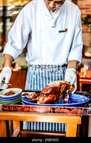 Chinese Chef chopping serving Peking duck Stock Photo - Alamy