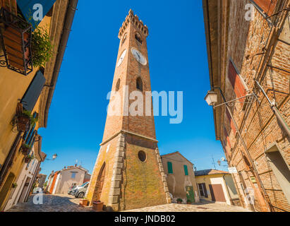 dizzy clock tower in ancient square of medieval village in Romagna ...